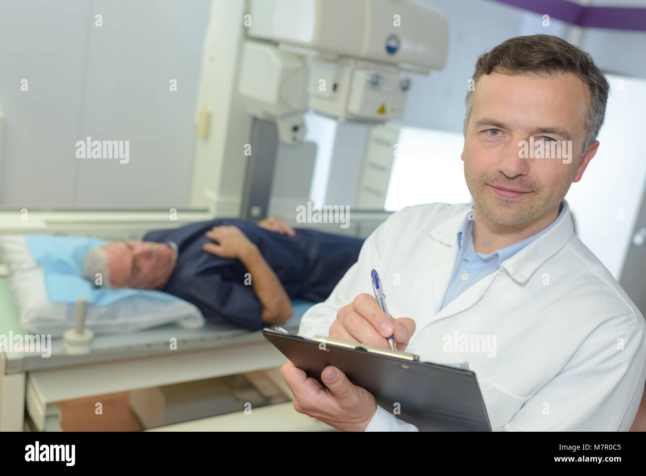 doctor holding the patients file Stock Photo - Alamy