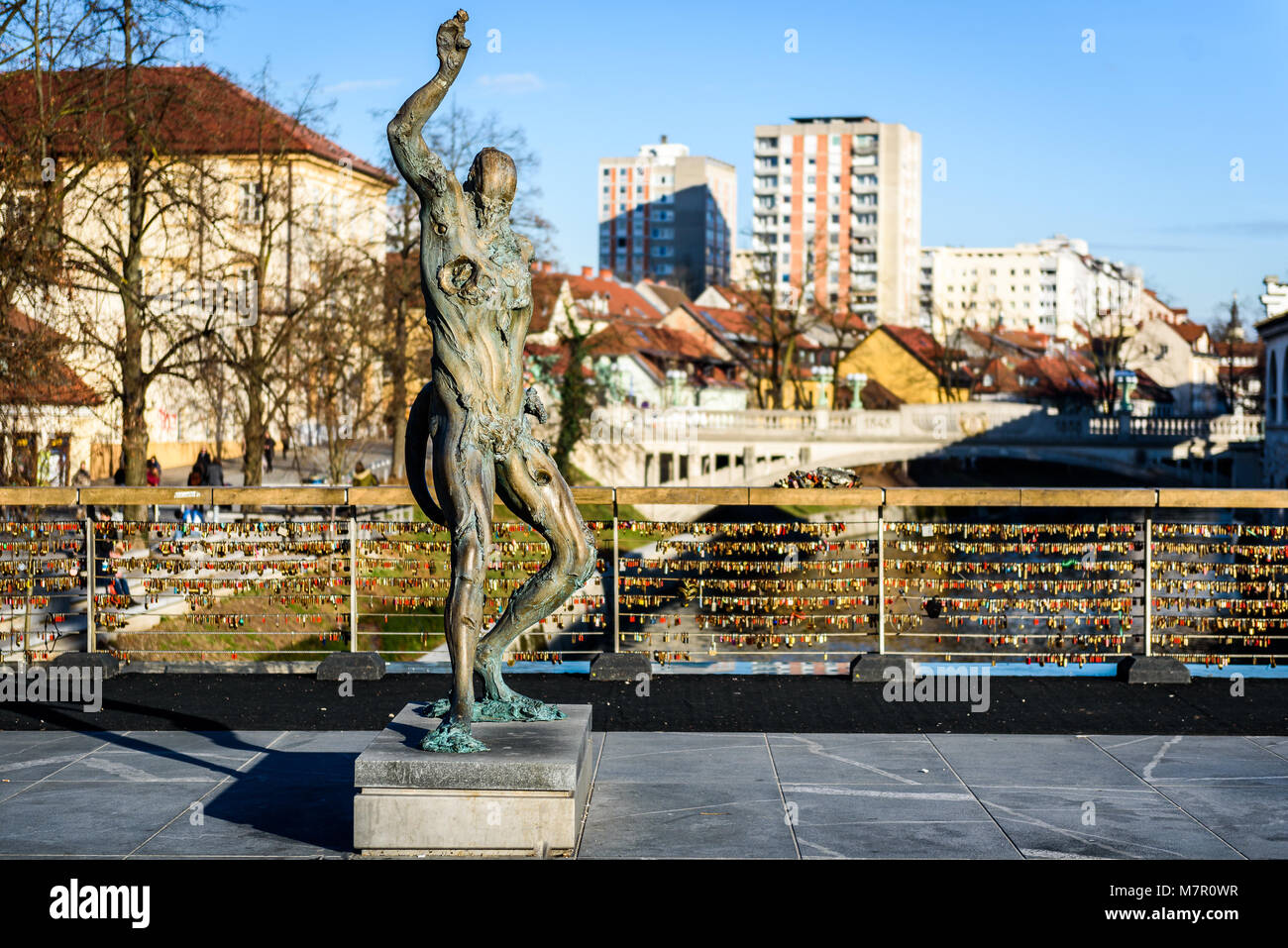 Statue of Prometheus on Butchers' bridge over river Ljubljanica ...