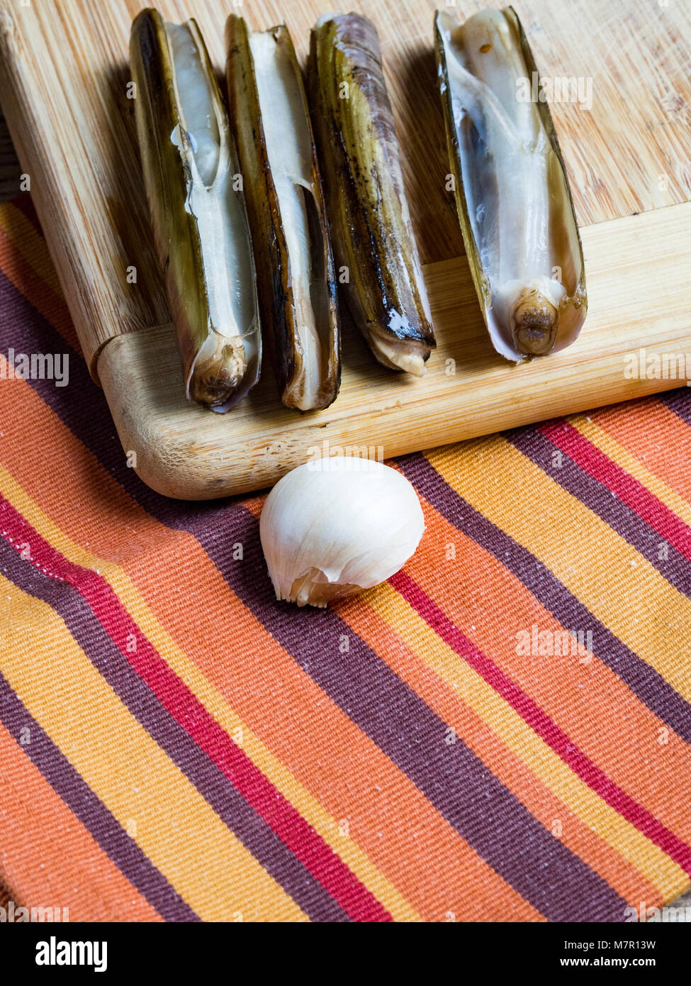 Raw razor clams Stock Photo - Alamy