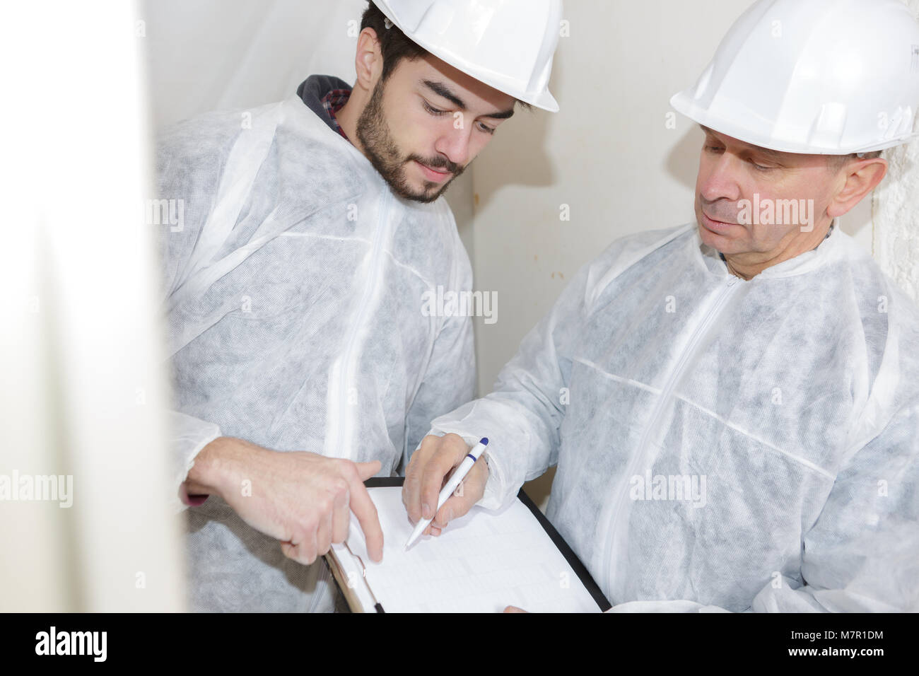 young builder manager and his teacher Stock Photo - Alamy