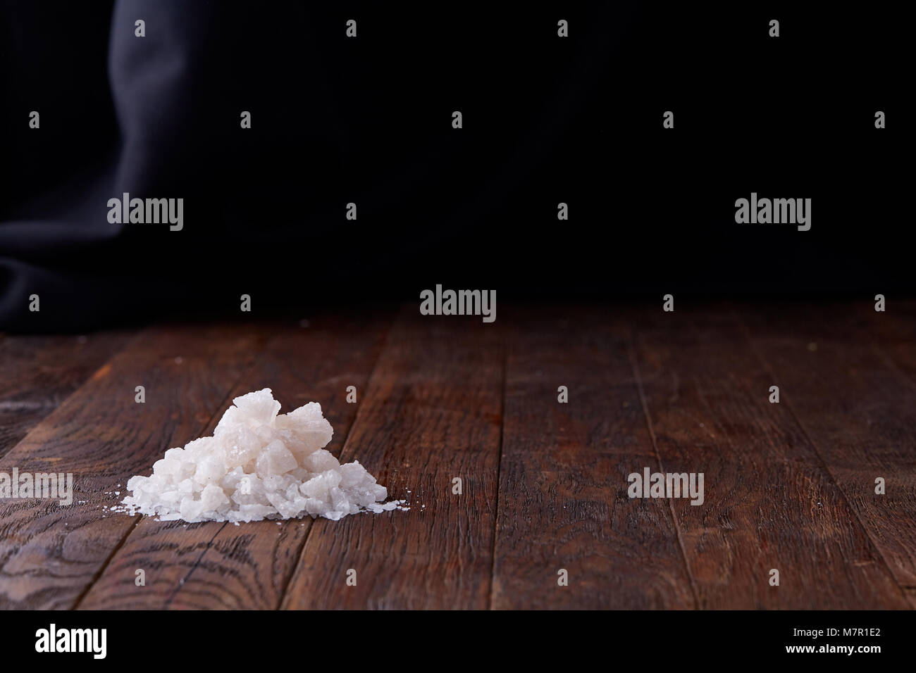 Pile of salt crystals on the vintage background, top view, flat lay ...
