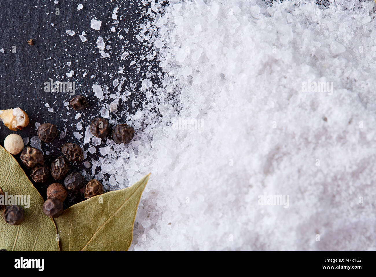 Composition of bay laurel leaf with peppercorn and salt isolated on ...