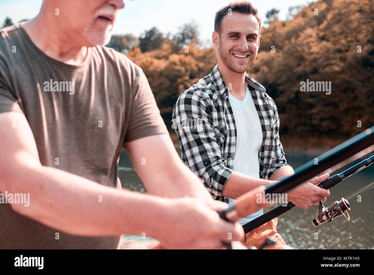 Male fisherman catching fish standing hi-res stock photography and ...