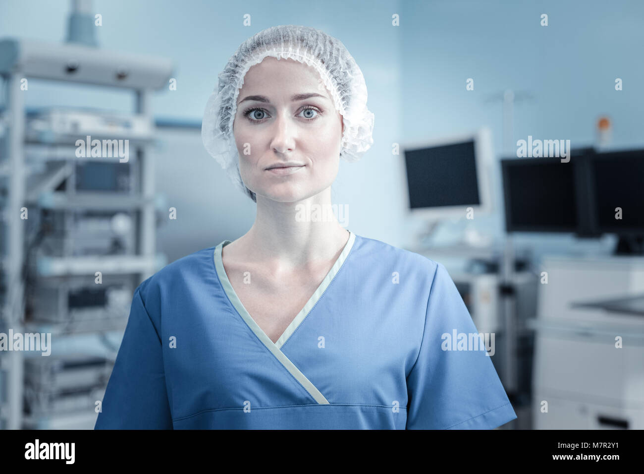 Serious concentrated nurse looking straight focusing her view Stock ...