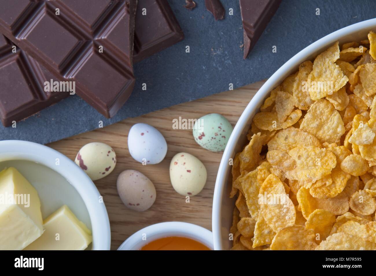 Easter corn flake cake ingredients with mini chocolate eggs top down ...