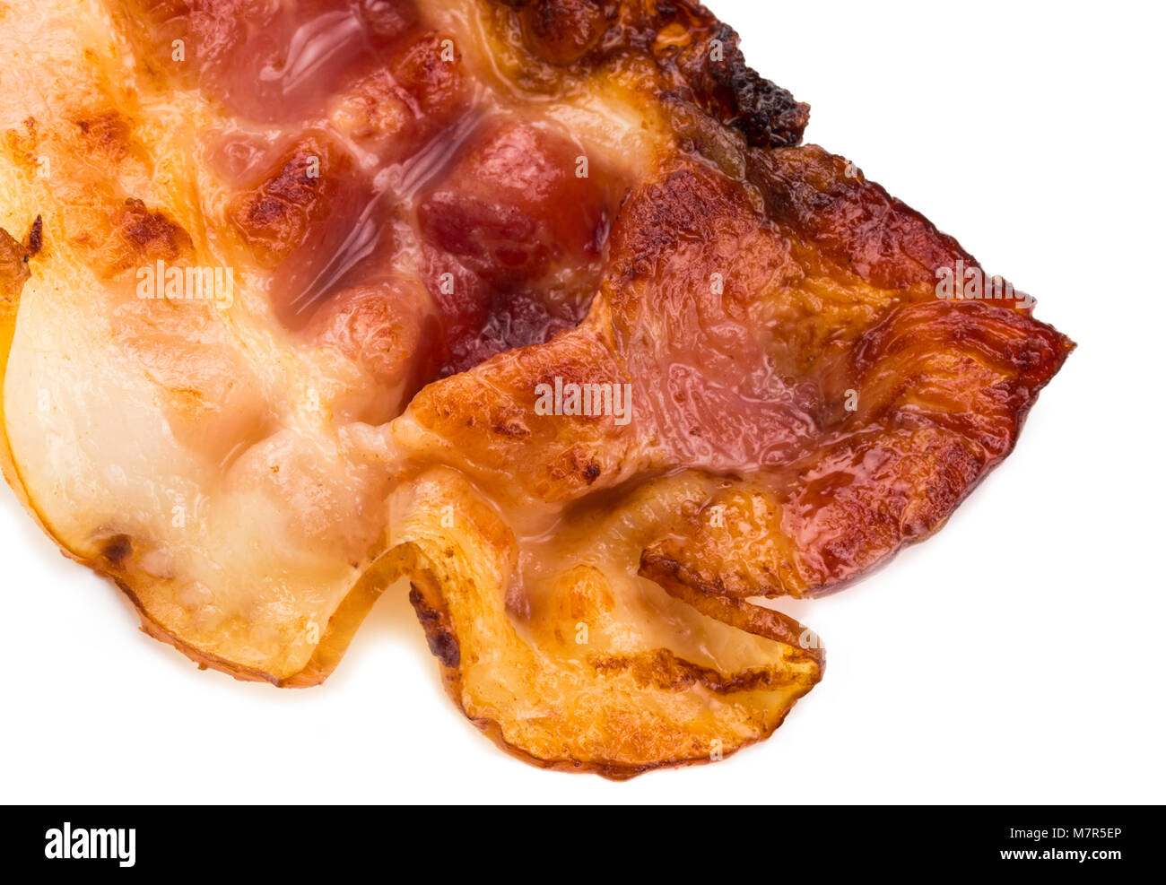 cooked crispy slice of bacon isolated on white background. close up ...