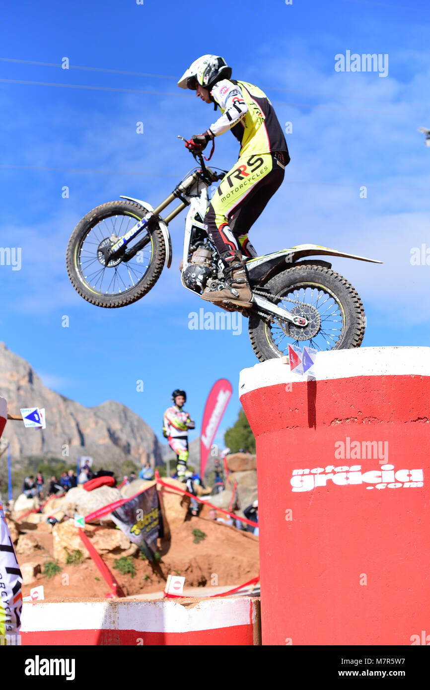 LA NUCIA, SPAIN - FEBRUARY 11th 2018: Unknown rider masters an obstacle ...