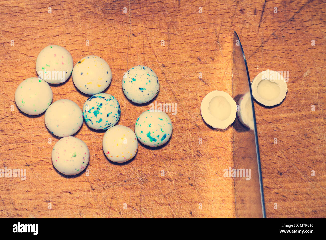 The empty white chewing gum is cut in half with a kitchen knife Stock ...