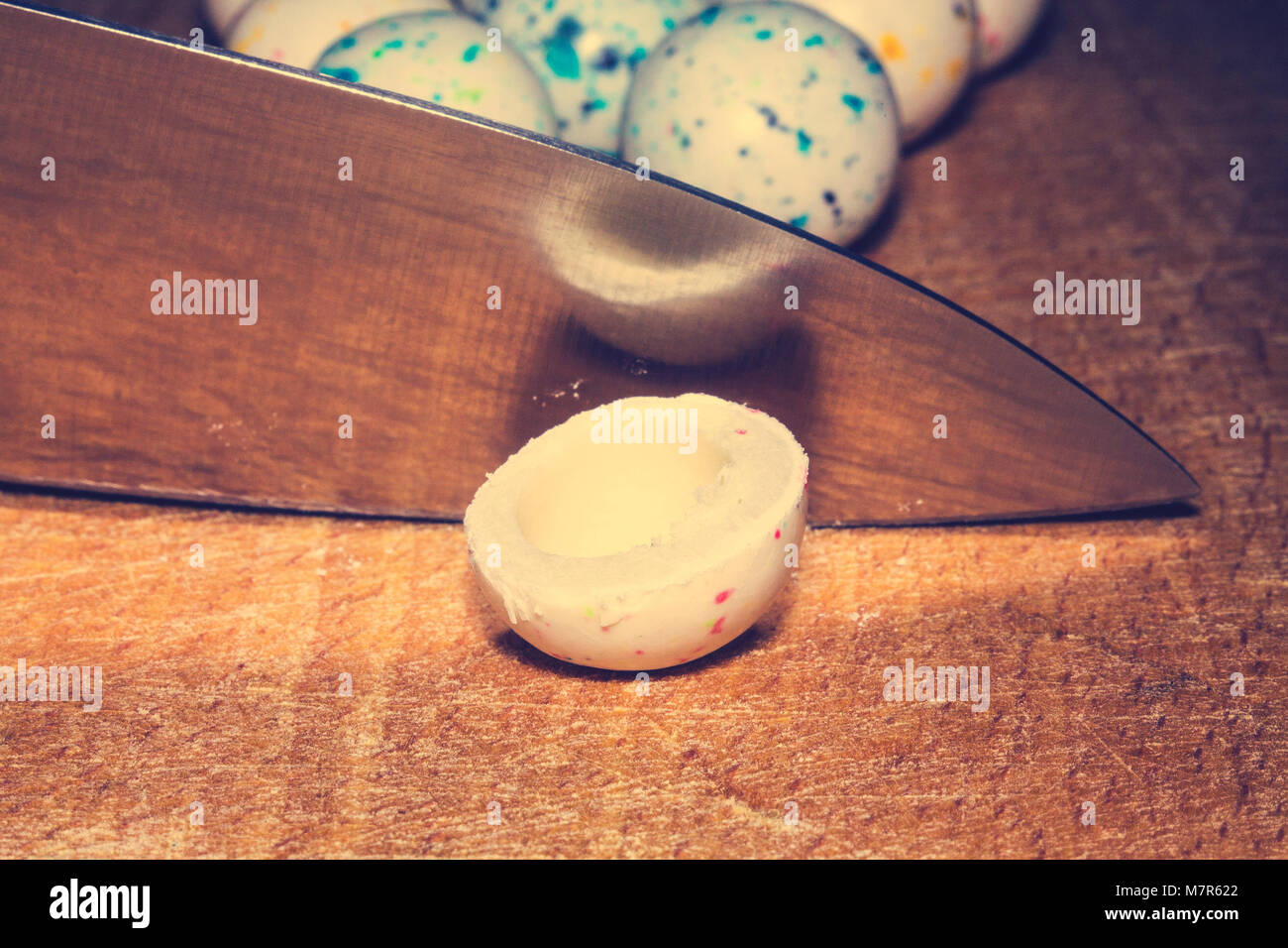 The empty white chewing gum is cut in half with a kitchen knife Stock ...