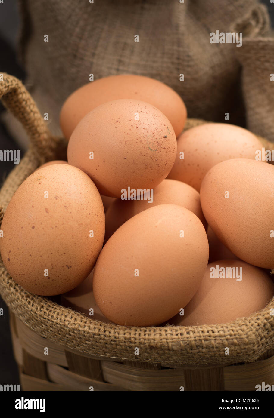 Brown farmers cage-free chicken eggs in basket, close up Stock Photo ...