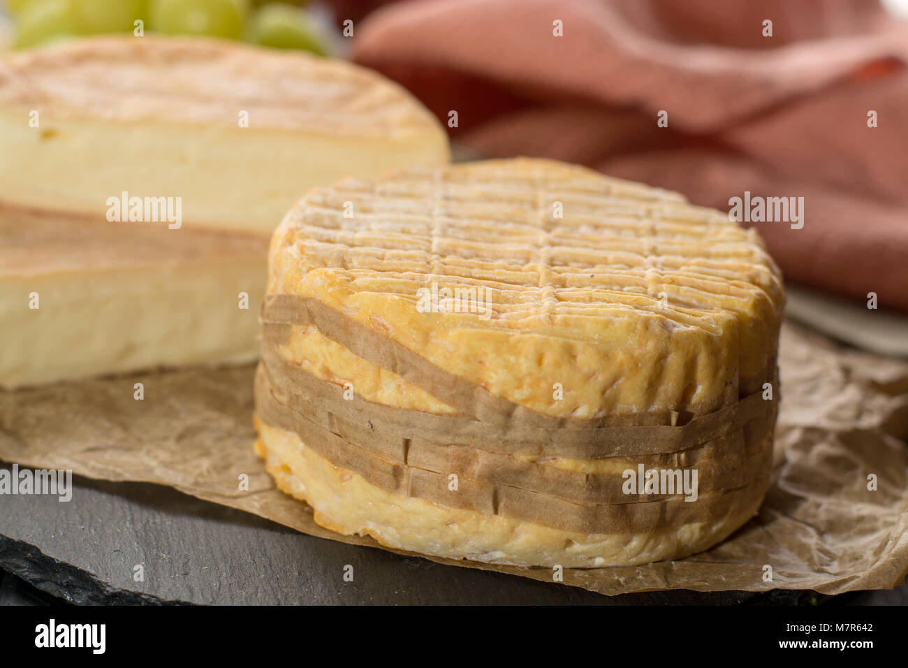 Tasting of oldest french AOC soft pudgent yellow cheese Livarot and ...