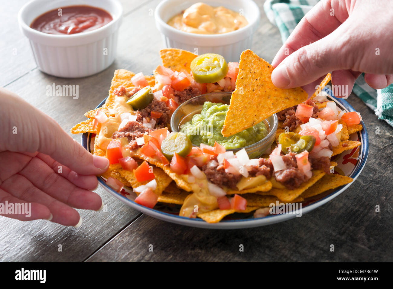 Eating nachos people hi-res stock photography and images - Alamy