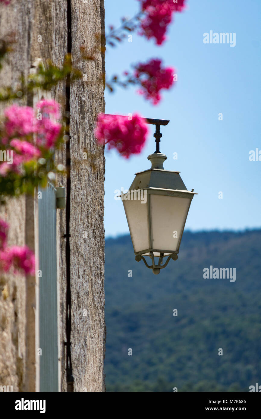French style old vintage iron with glass street light in small village ...