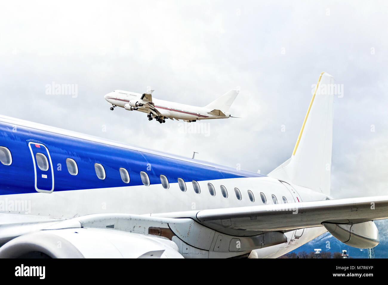 Taking off aircraft at the airport in cold weather, big blue plane ...