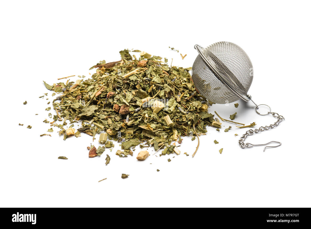 heap of mixture for tea with infuser on white background Stock Photo ...