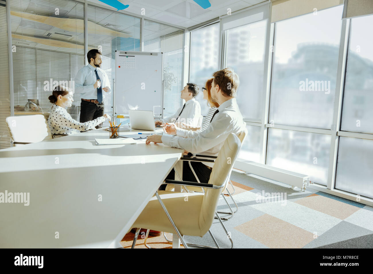 Colleagues teamwork coworkers listening hi-res stock photography and ...