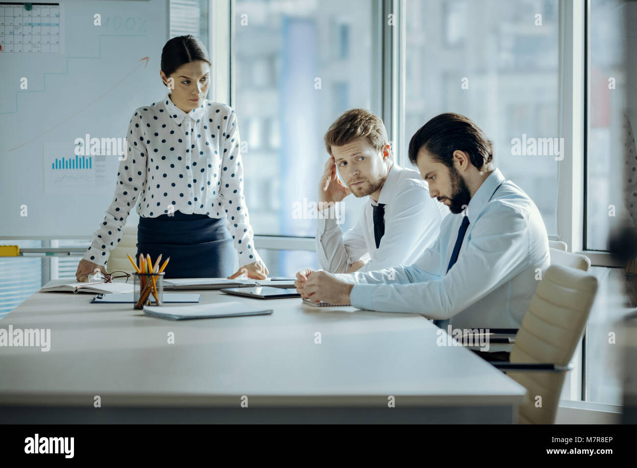Strict female boss scolding her employees Stock Photo - Alamy