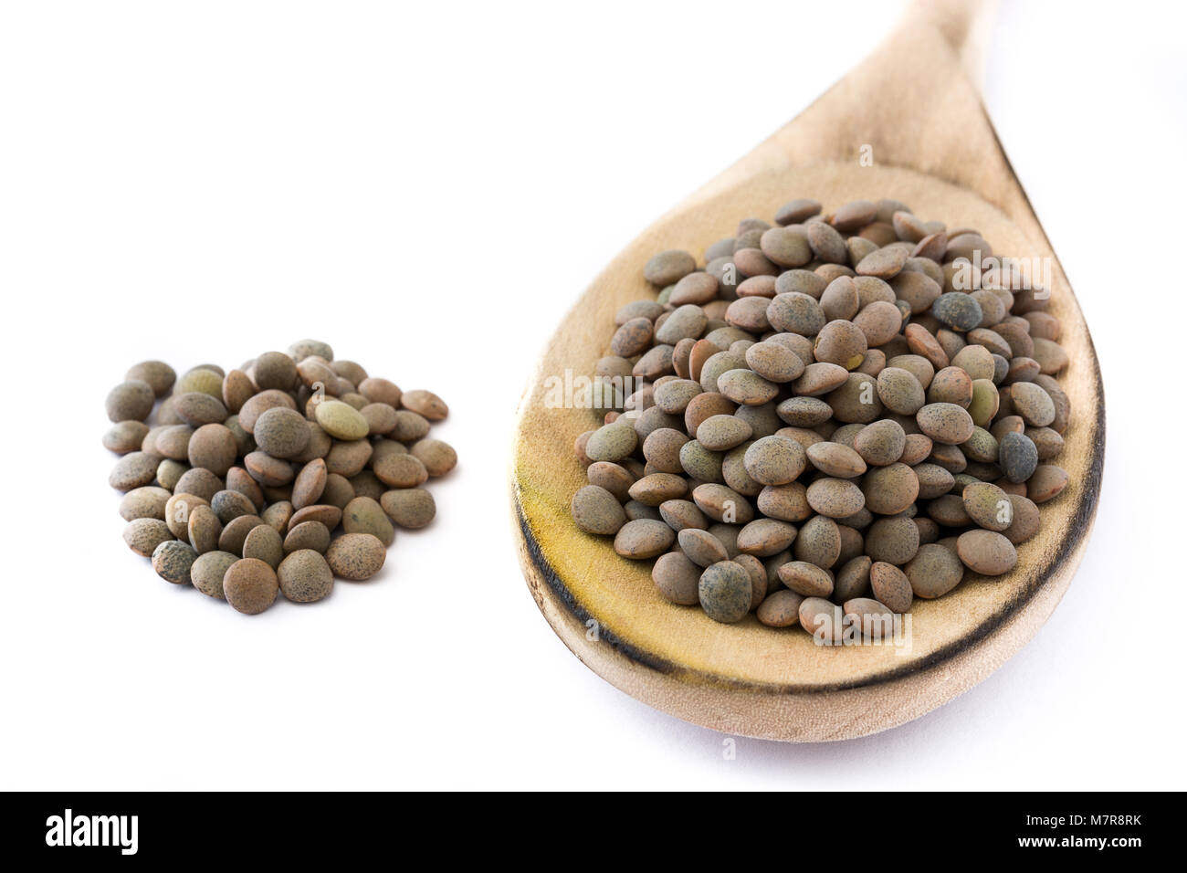 Lentils grain on wooden spoon isolated on white background Stock Photo ...