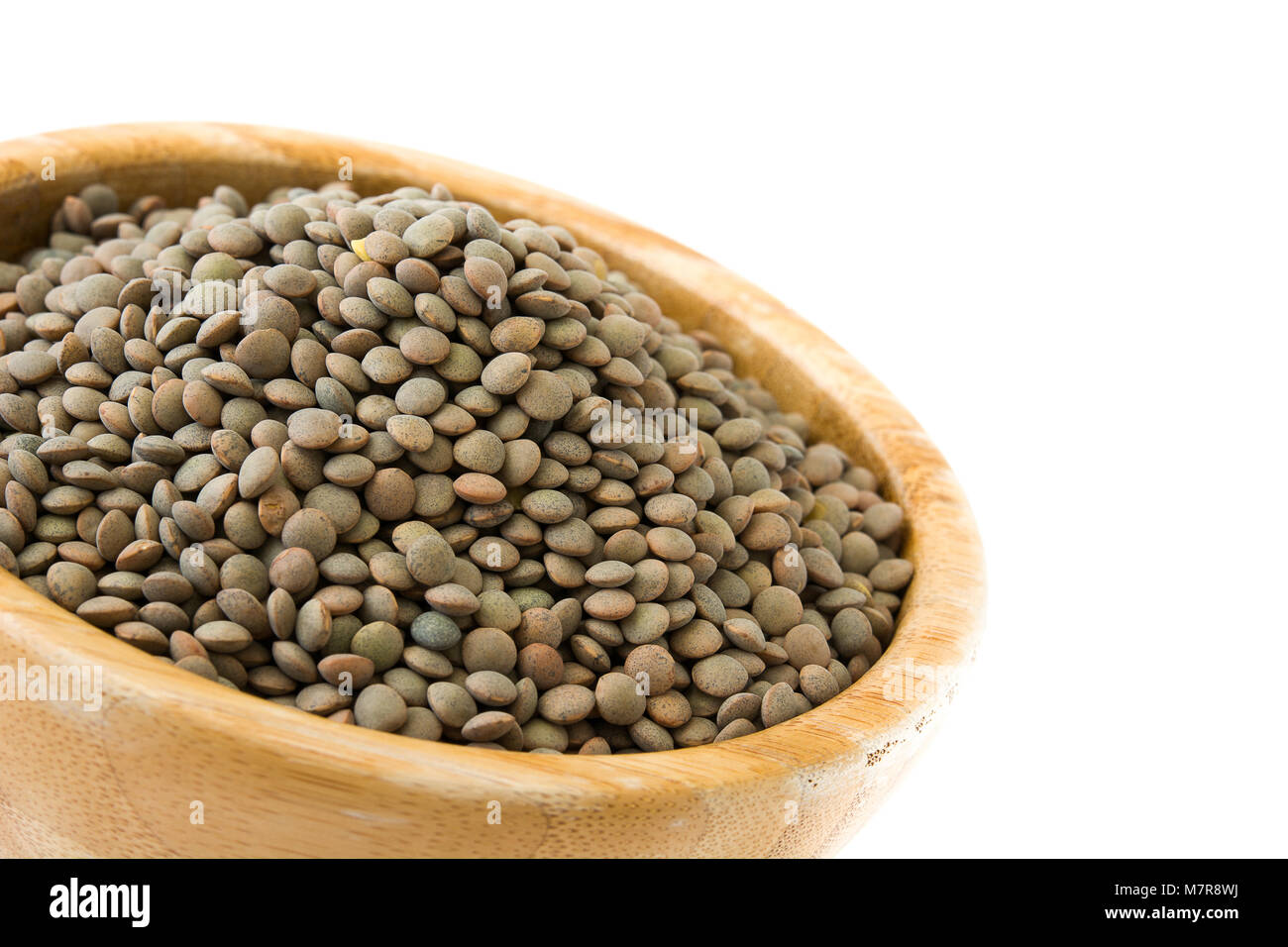 Lentils grain on wooden bowl isolated on white background Stock Photo ...