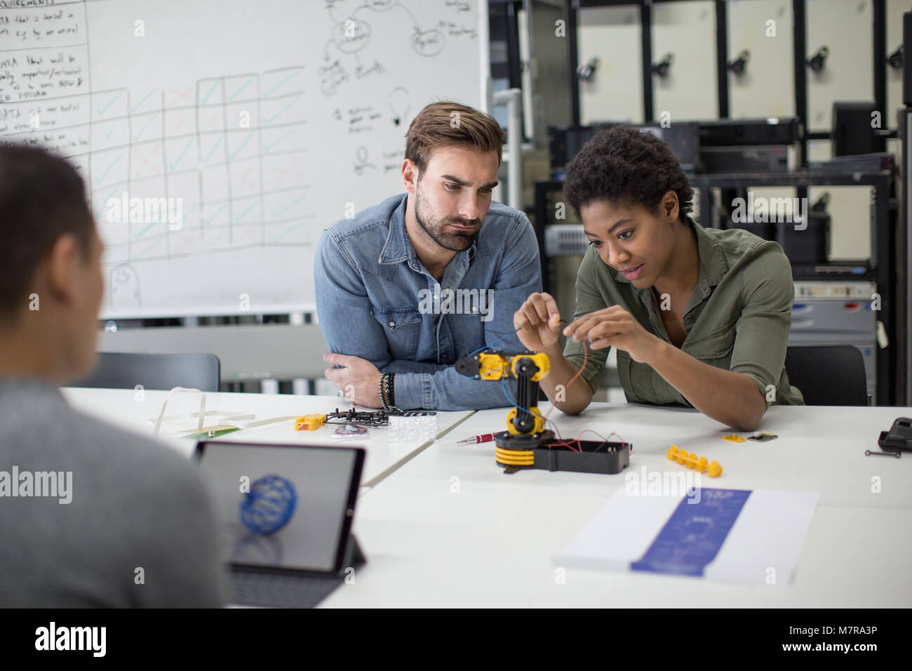 Team working on robotic technology Stock Photo - Alamy