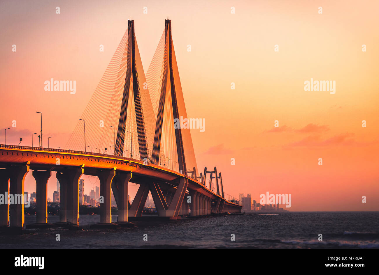 A sunset at Bandra Worli Sea link in Mumbai, India. It is a cable ...