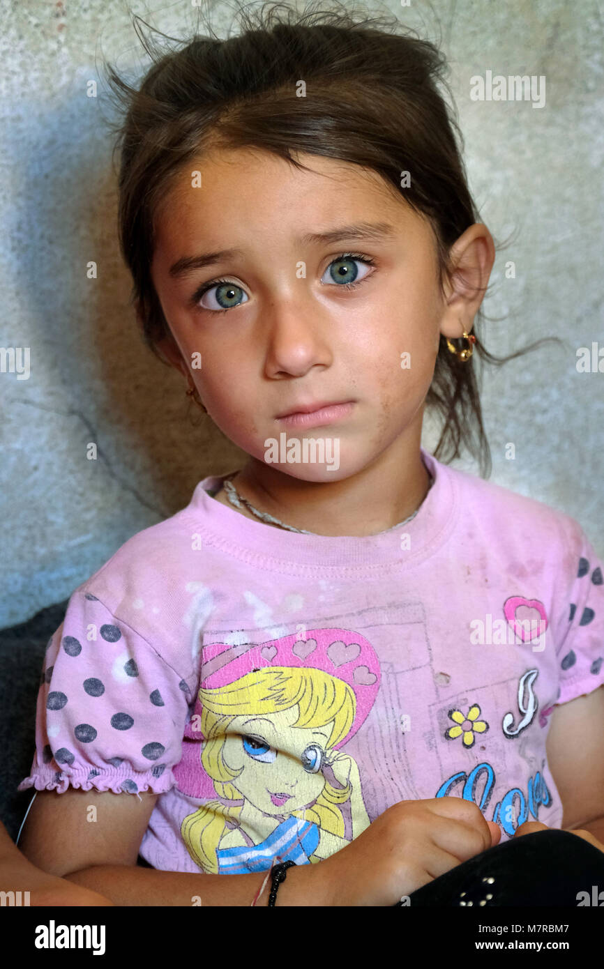 Sad looking Yazidi refugee girl in village Levo, Kurdistan, Northern ...