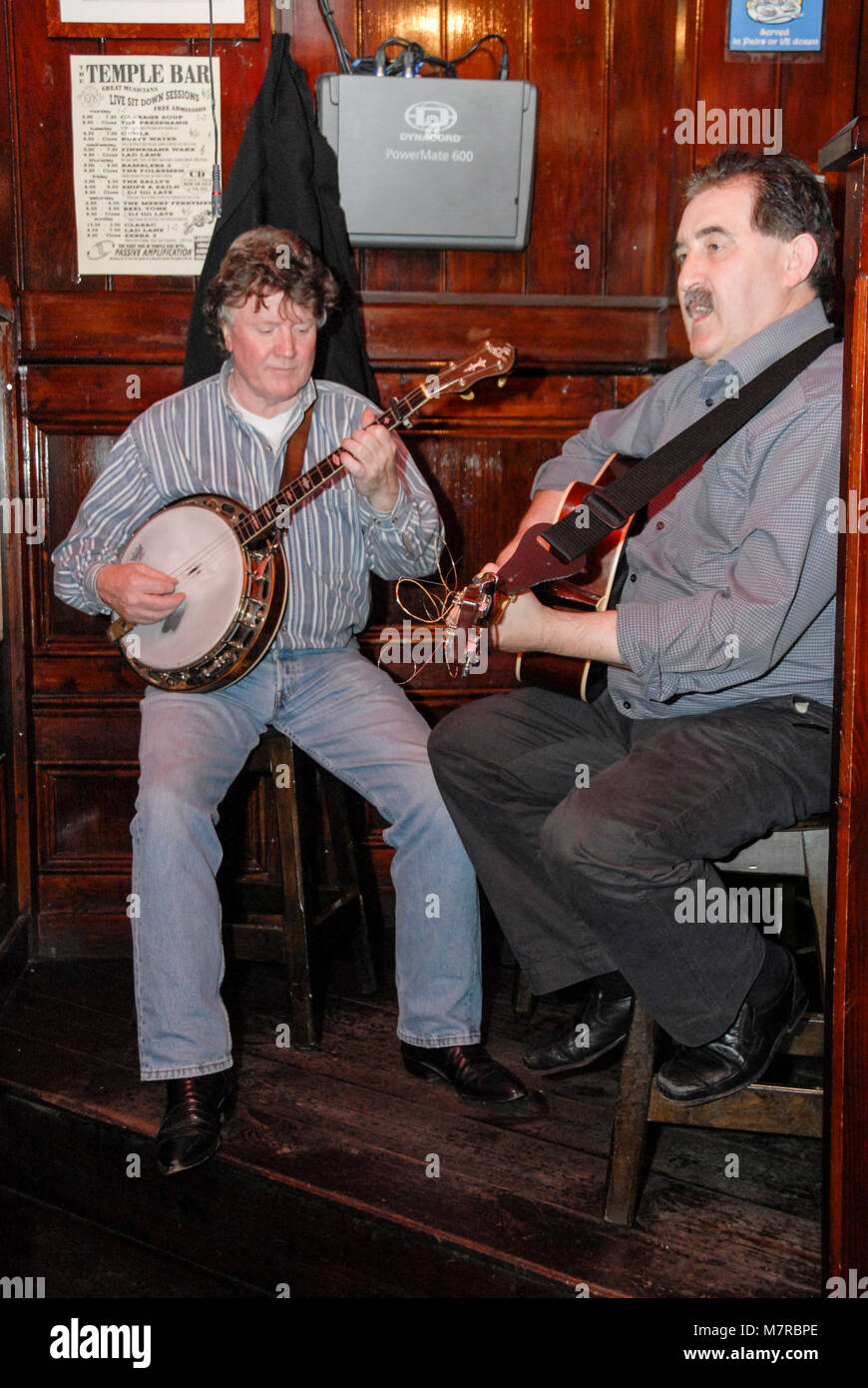 Many pubs and bars provide live music. These musicians performing in ...