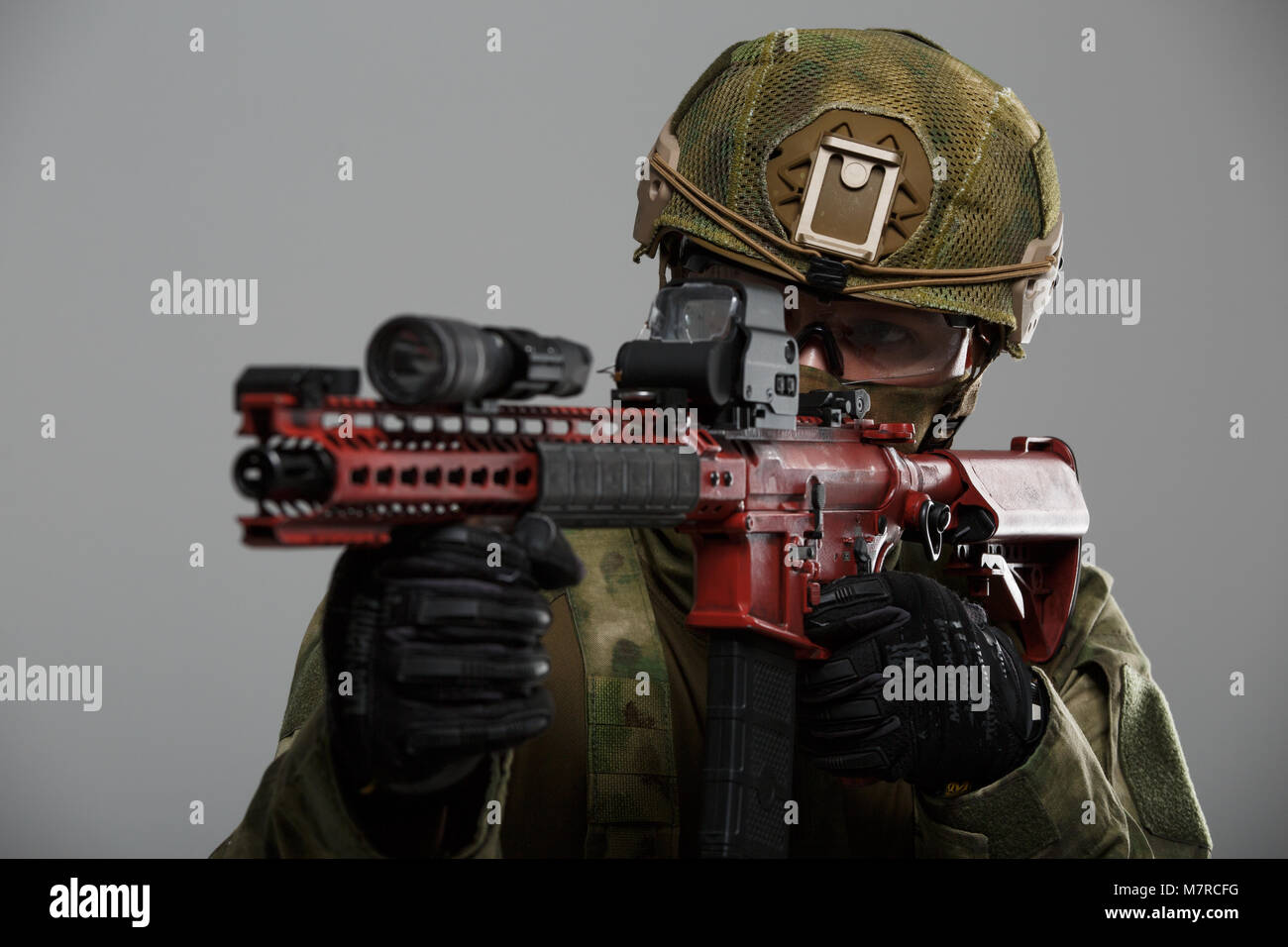 Photo of aiming military man in helmet with gun Stock Photo - Alamy