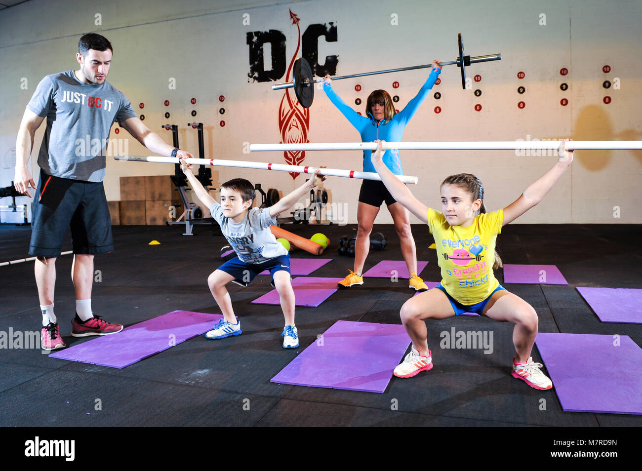 Boy lifting girl hi-res stock photography and images - Alamy