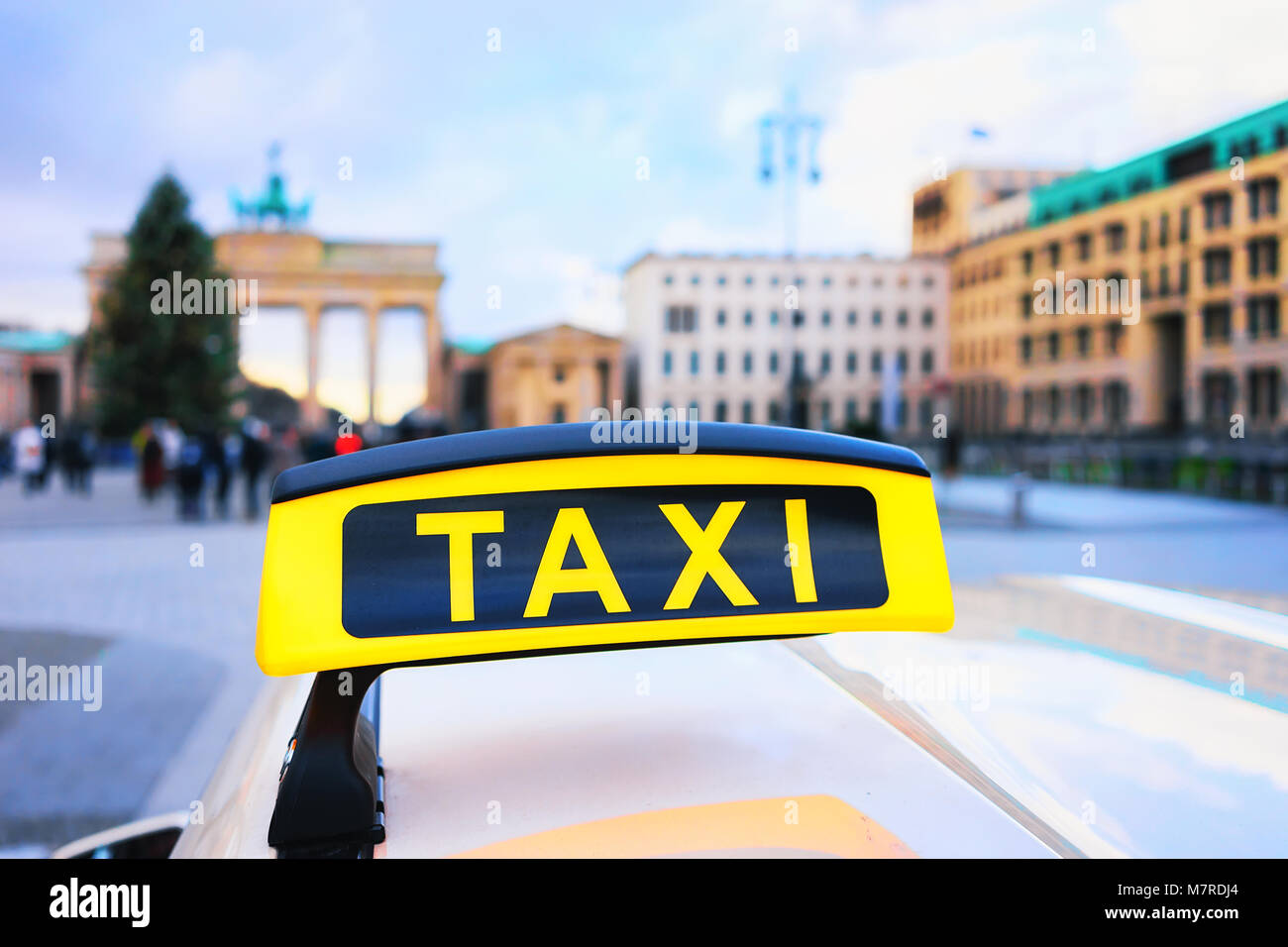 Taxi sign board in the street of Berlin, Germany. Brandenburg gate on ...
