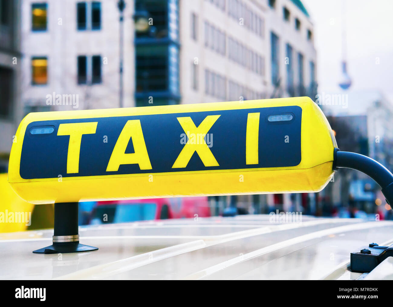 Taxi sign board in the street of Berlin, Germany. Television tower on ...