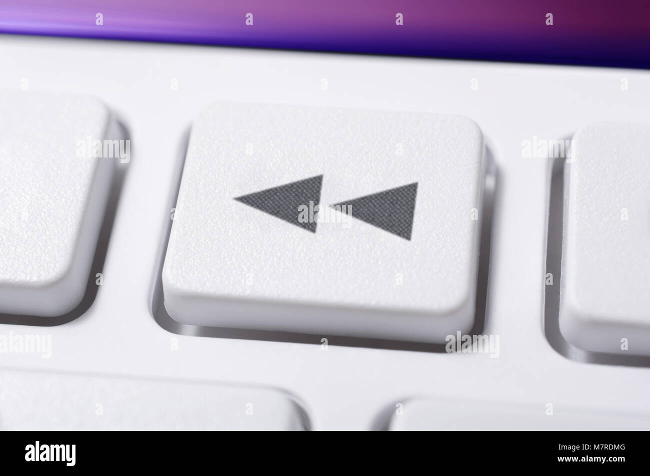 Close Up Of A White Rewind Button Of A White Remote Control For A Hifi ...