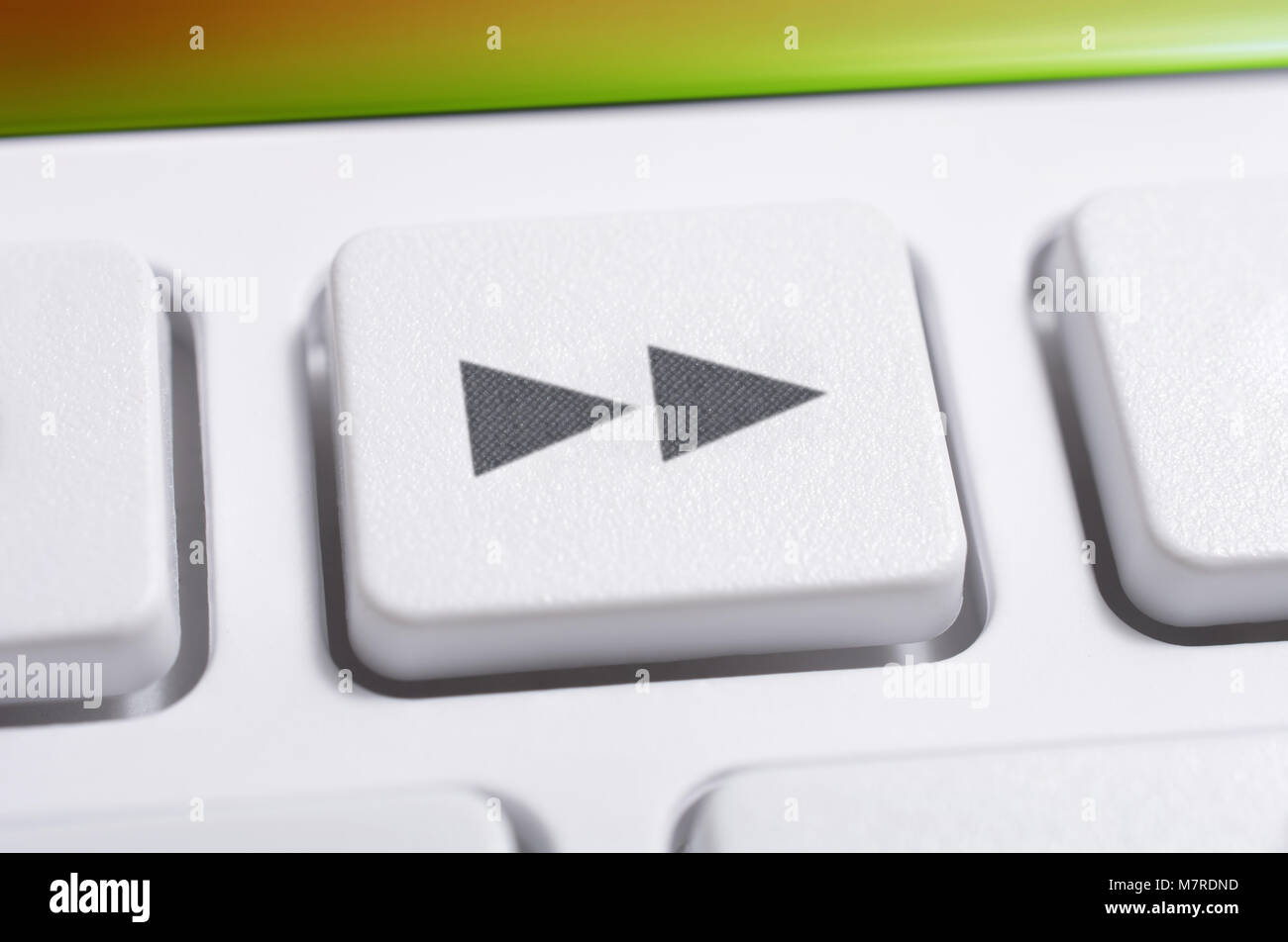 Close Up Of A White Fast Forward Button Of A White Remote Control For A ...