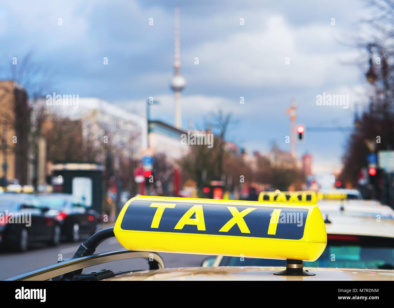 Taxi sign board on the street of Berlin, Germany. Television tower on ...