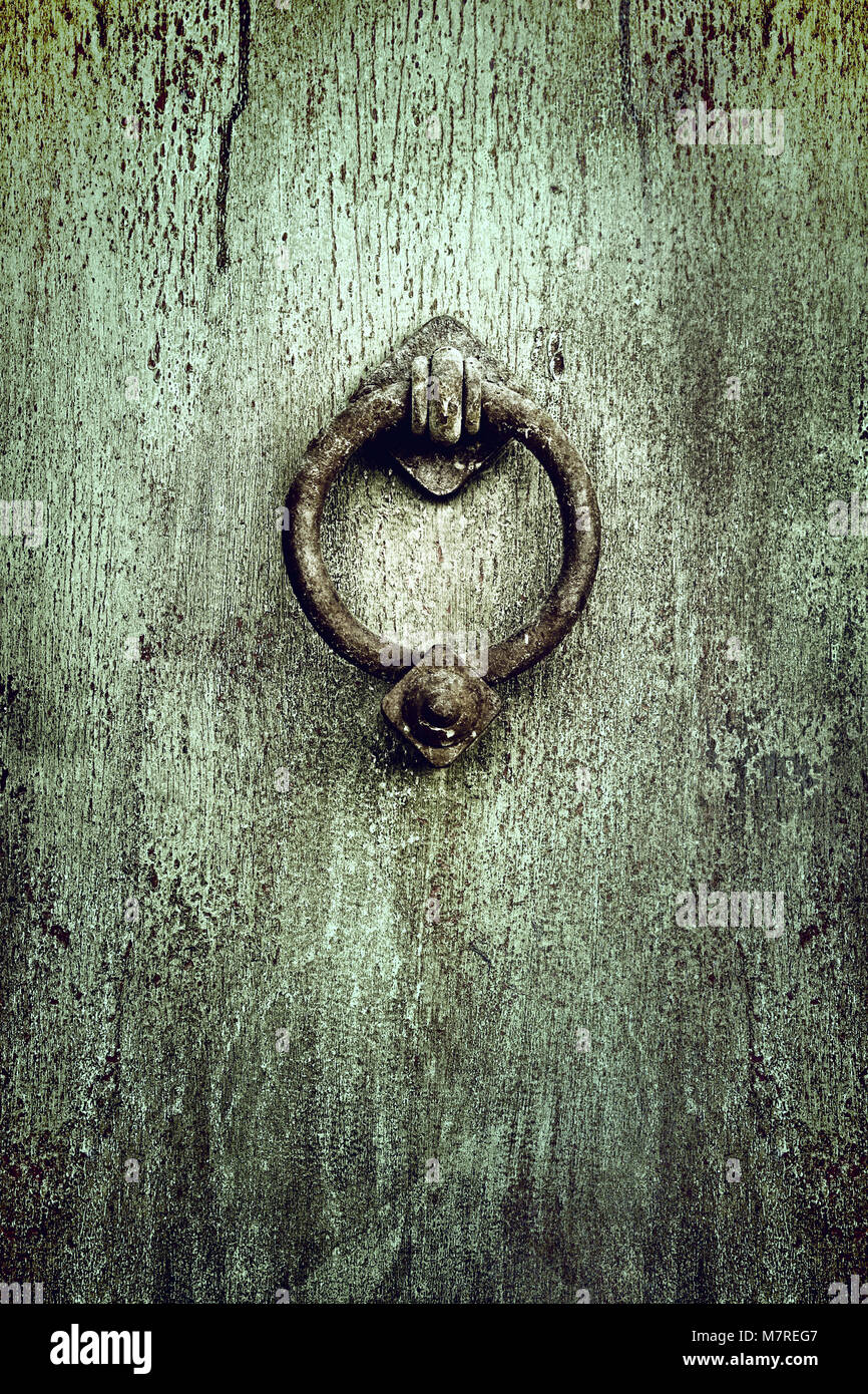 Old rusty knob or knocker on aged metallic retro door Stock Photo - Alamy