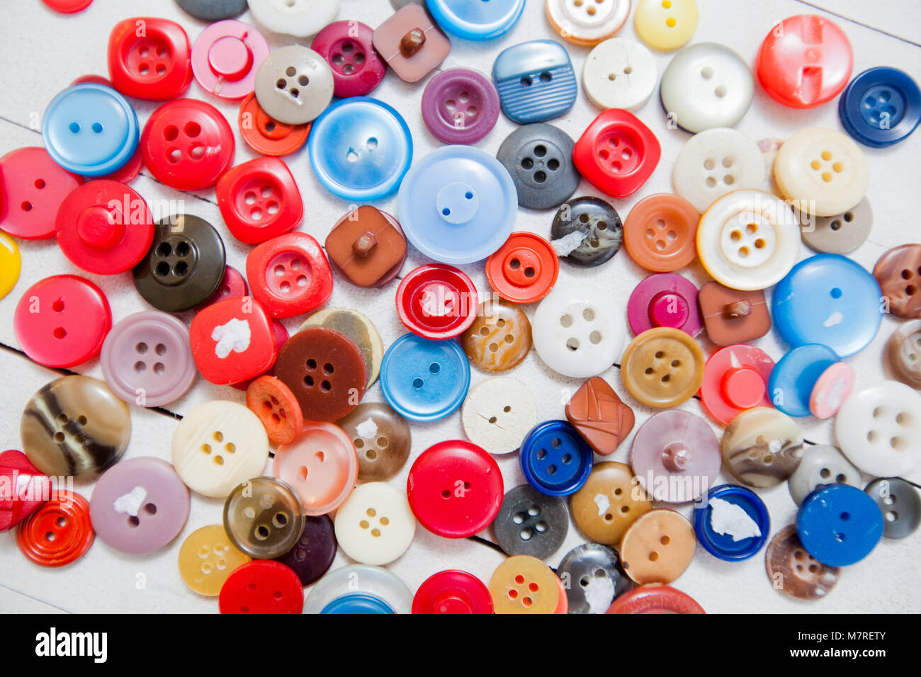 Colorful sewing button background, many different colors and shape ...