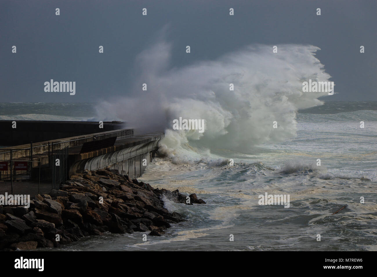 Big storm waves reach a breakwater structure in a pier in the Atlantic ...