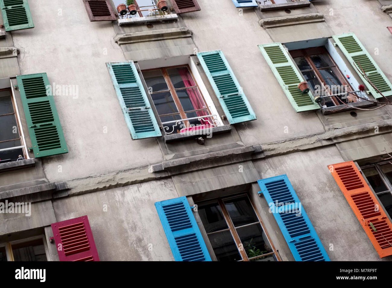 Colourful wooden window shutters in Geneva, Switzerland Stock Photo - Alamy
