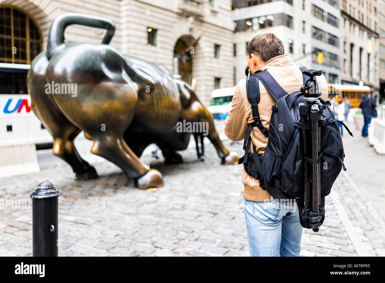 New York City, USA - October 30, 2017: Wall Street stock exchange charging metal bull in NYC ...