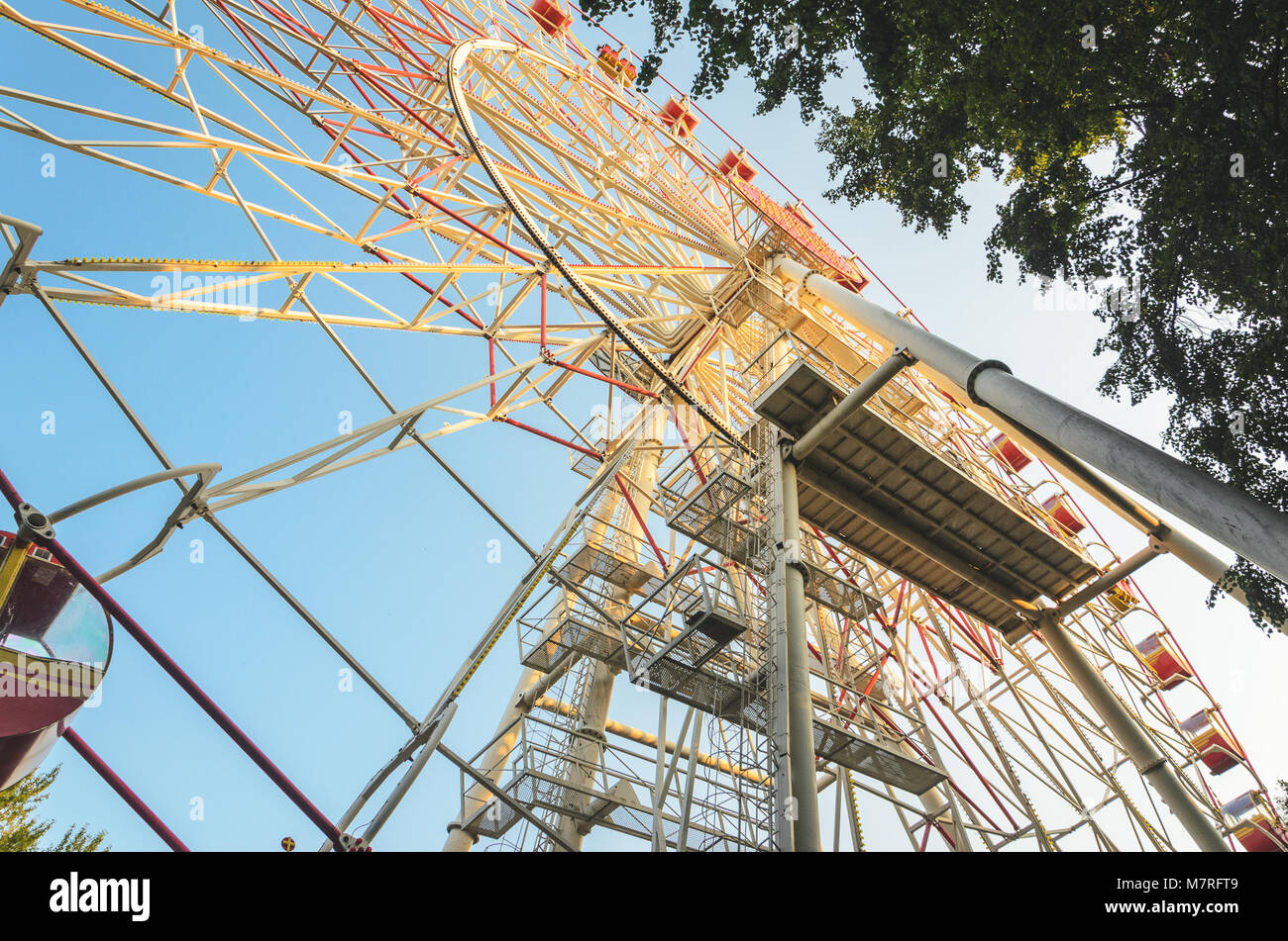 Ferris Wheel at Sunset in Amusement Park. Bottom View of the ...