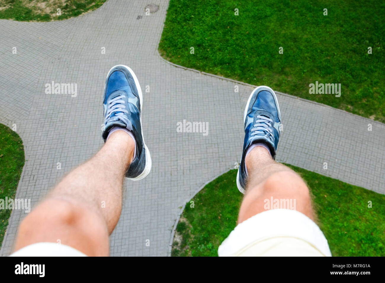 Feet Hanging in the Air First Person View. Above the City Park. The ...