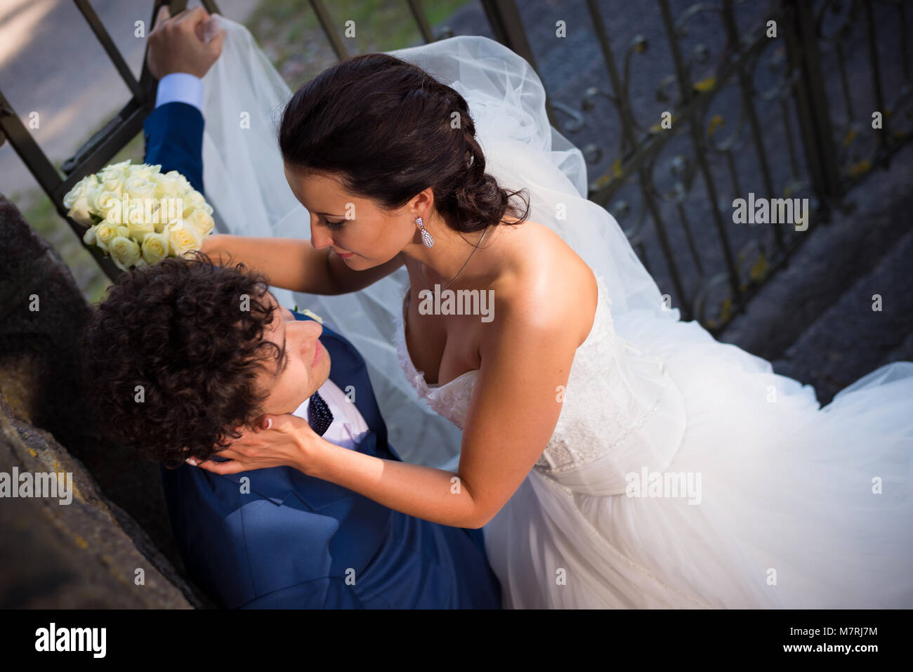 Just married couple huddling Stock Photo - Alamy
