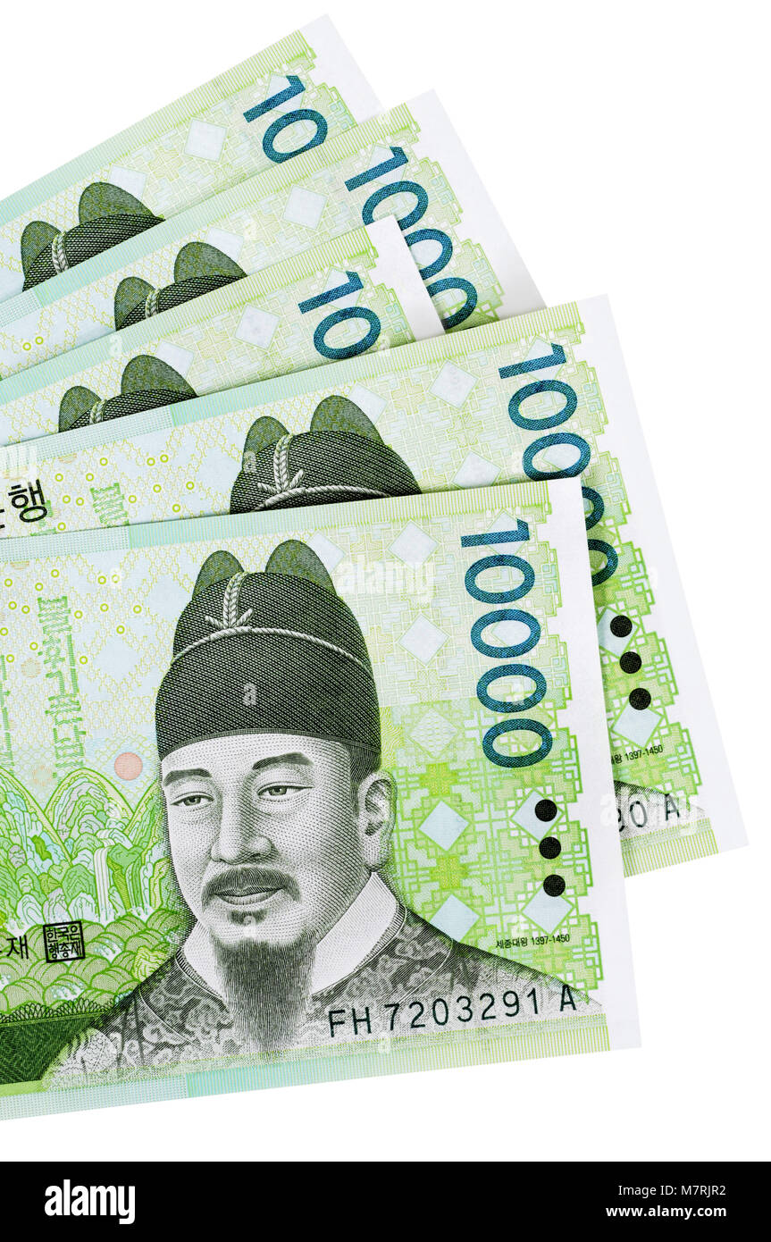 Several Korean 10,000 Won currency bills isolated on a white background ...