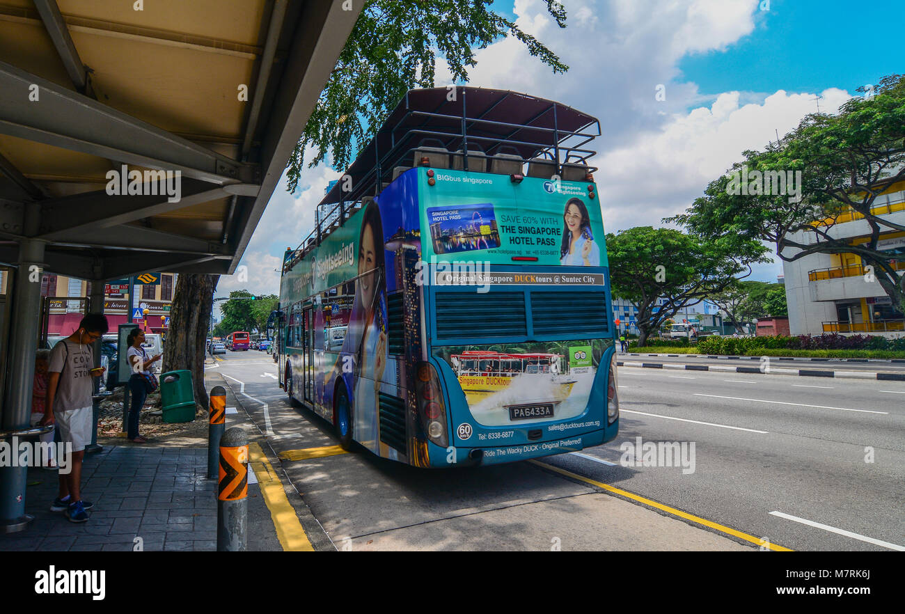 Singapore - Mar 13, 2016. A sightseeing bus running on street in ...