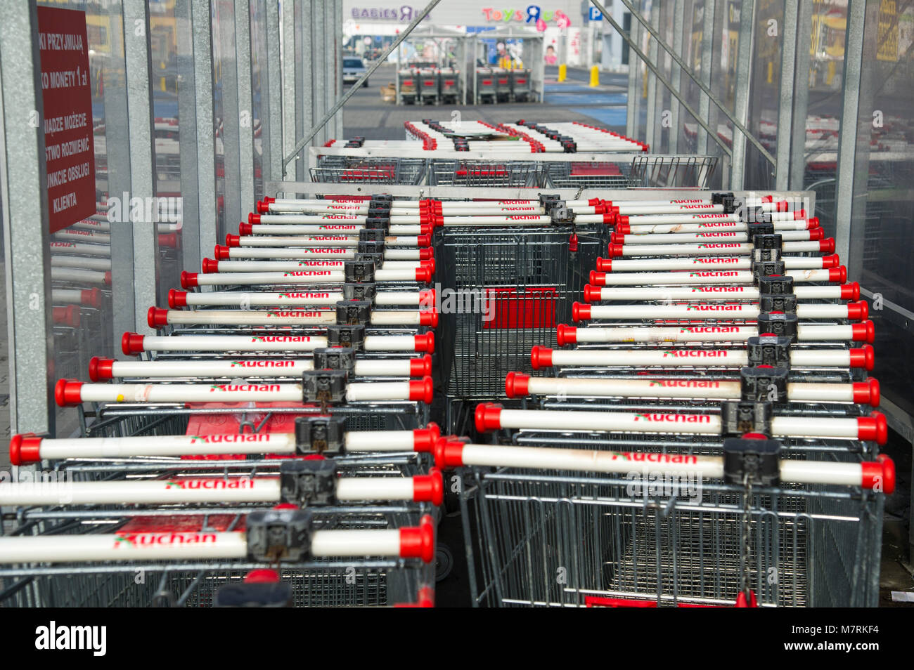 Parked shopping carts equipped with coin-operated locking mechanisms in ...