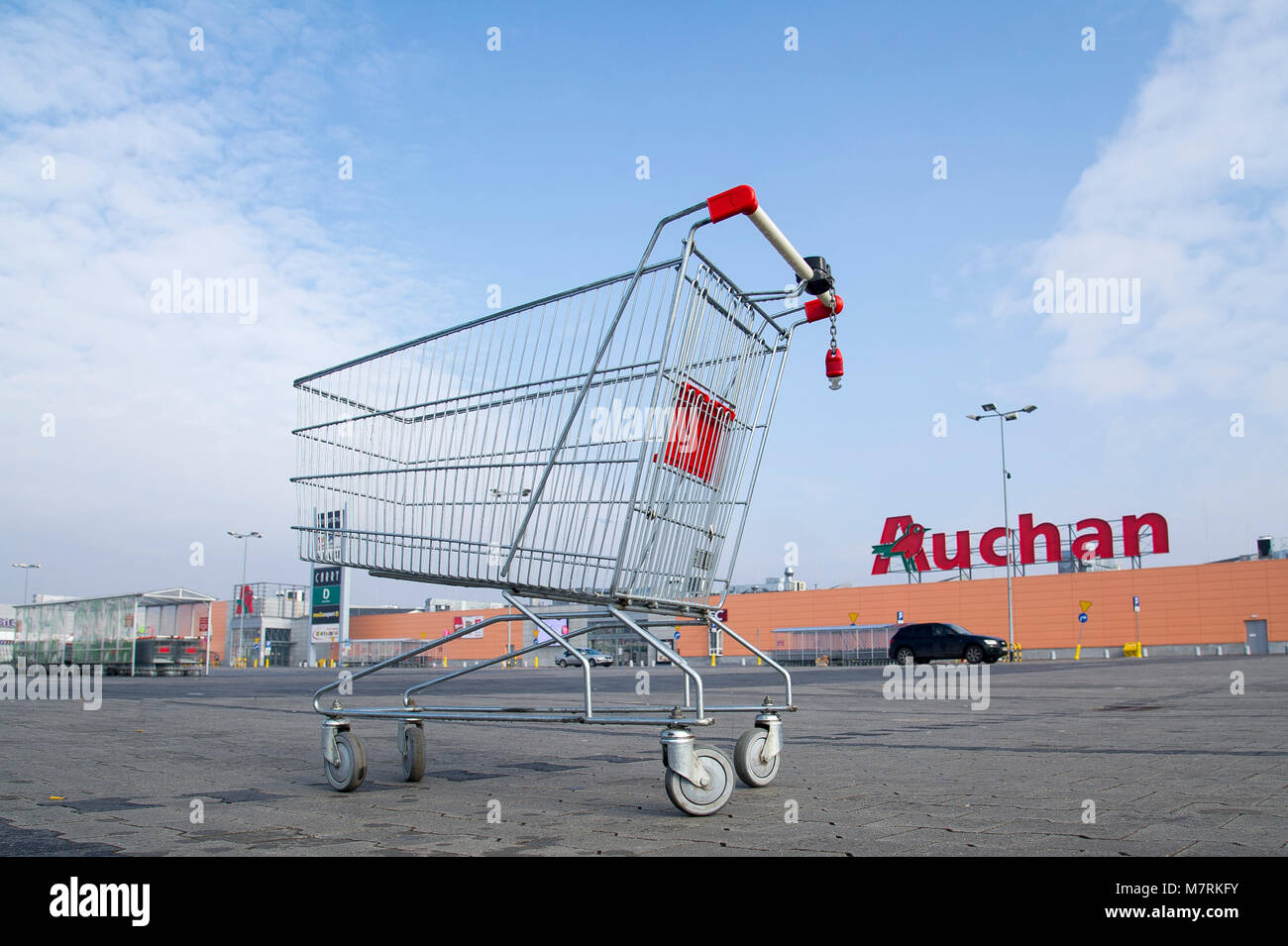 Parked shopping carts equipped with coin-operated locking mechanisms in ...