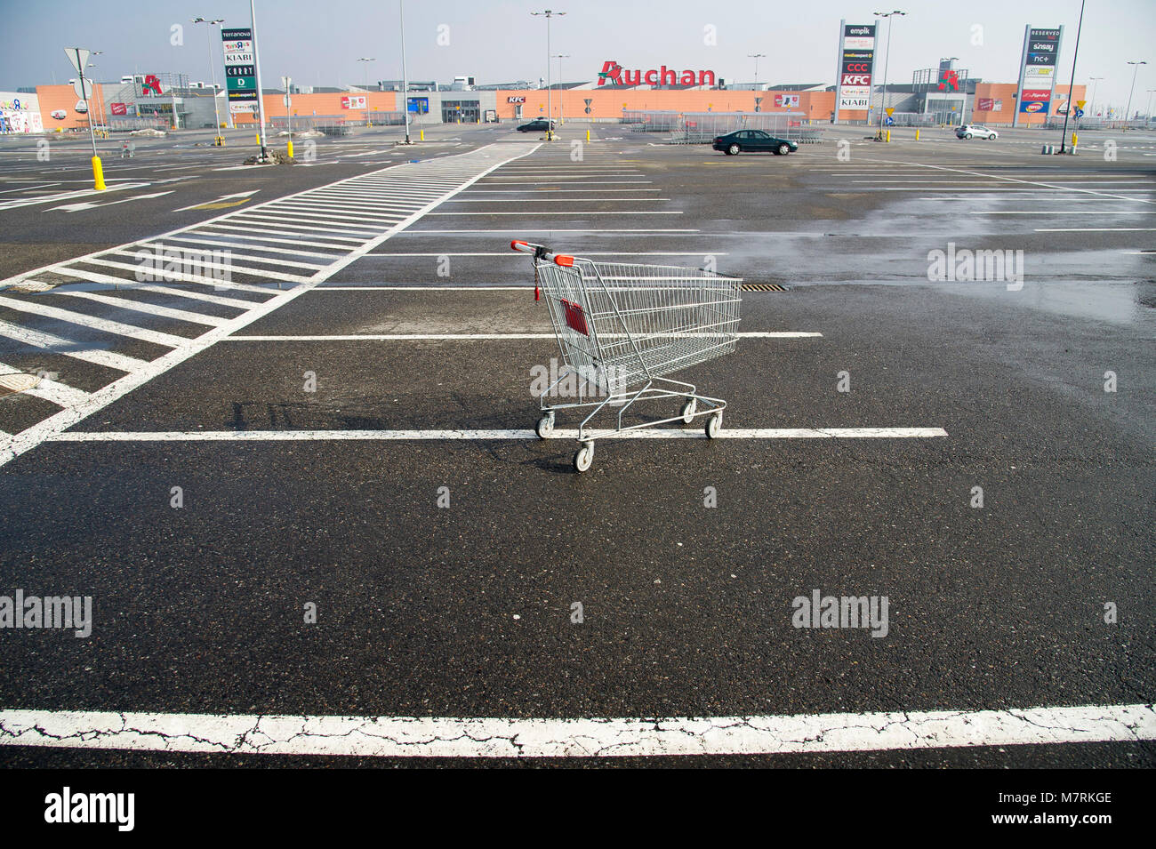 Parked shopping carts equipped with coin-operated locking mechanisms in ...
