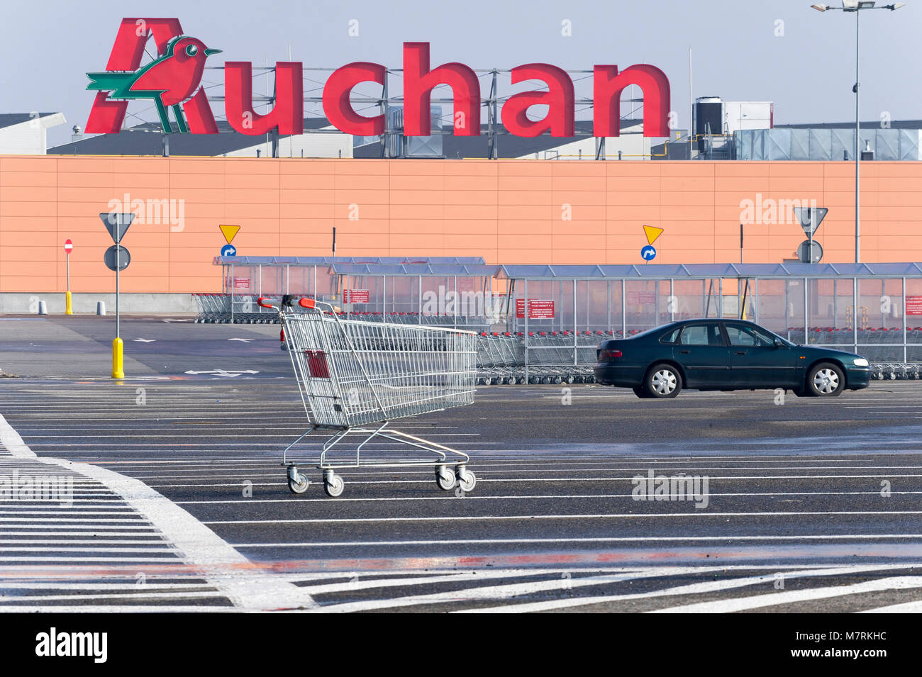 Parked shopping carts equipped with coin-operated locking mechanisms in ...