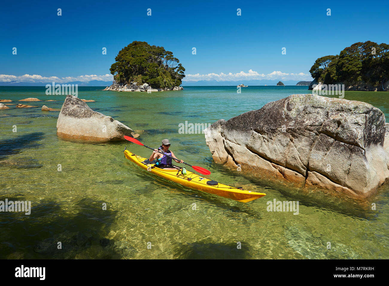 Kayaker, Mosquito Bay, Abel Tasman National Park, Nelson Region, South Island, New Zealand ...