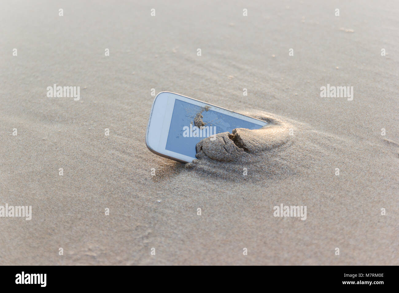 Mobile phone floated to the sea at the beach Stock Photo - Alamy